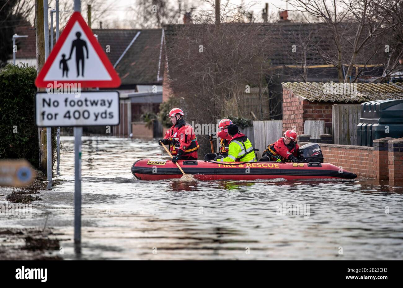 Rescue workers in the flooded village of east cowick hi-res stock ...