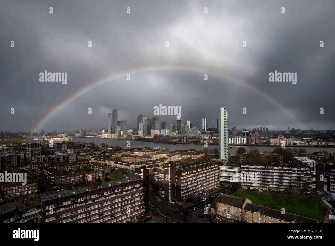 London, UK. 29th Feb, 2020. UK Weather: A massive rainbow breaks over ...