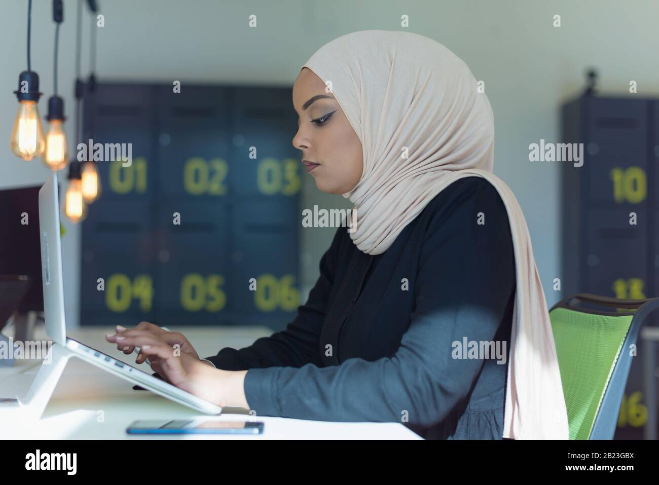 Young muslim African American business woman as a leader at work ...