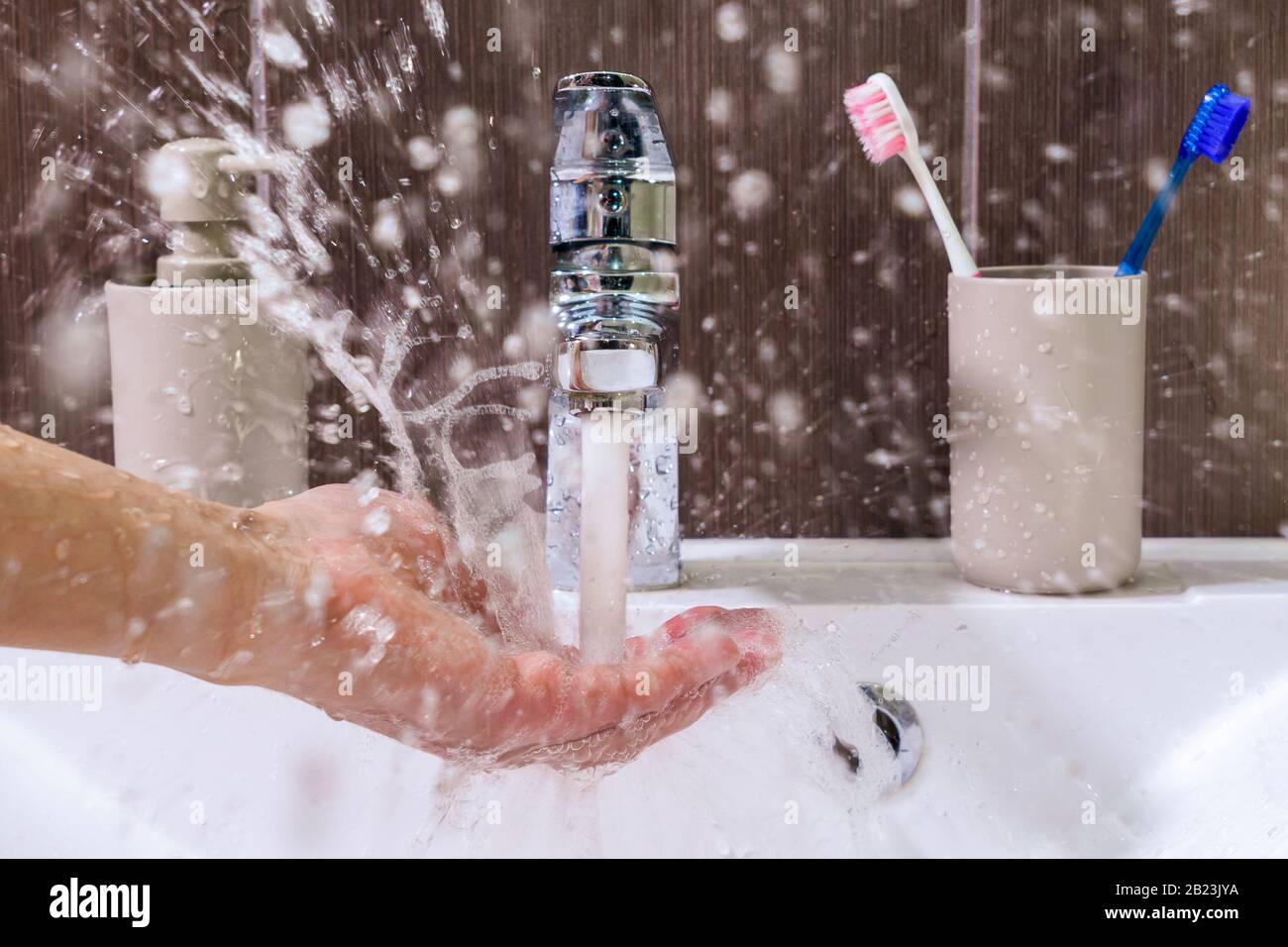 Water wasting from tap hi-res stock photography and images - Alamy