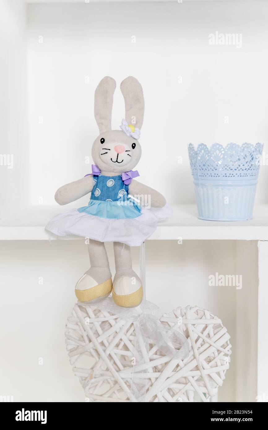 Toy doll sitting on shelf hi-res stock photography and images - Alamy