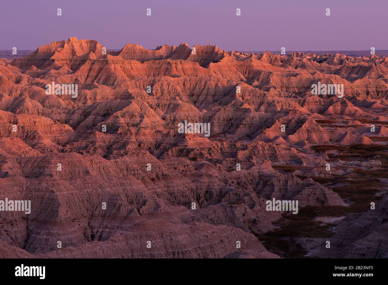 SD00251-00...SOUTH DAKOTA - Sunset painting the buttes orange along the ...