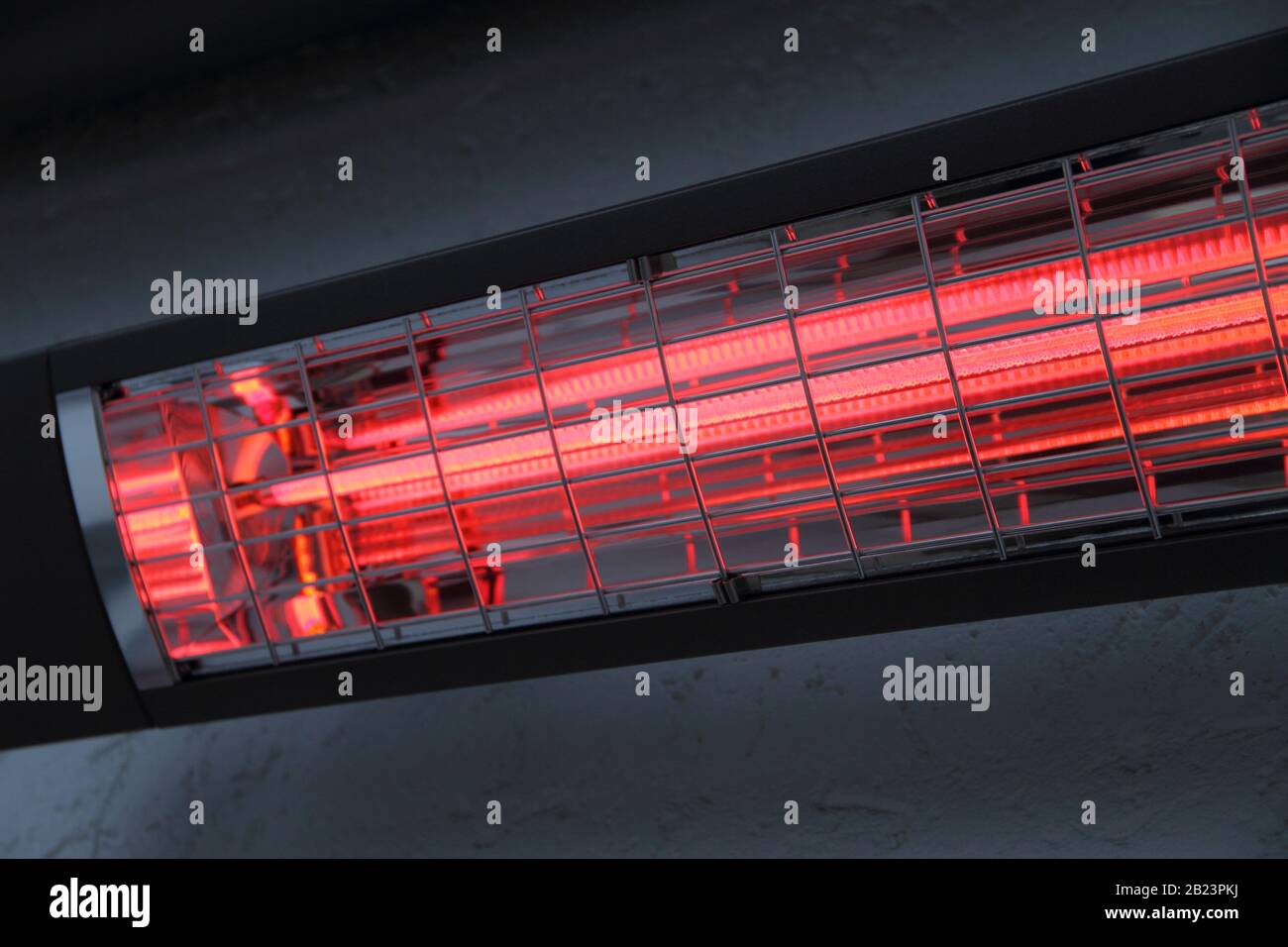 a switched on infrared heater on a house wall Stock Photo - Alamy