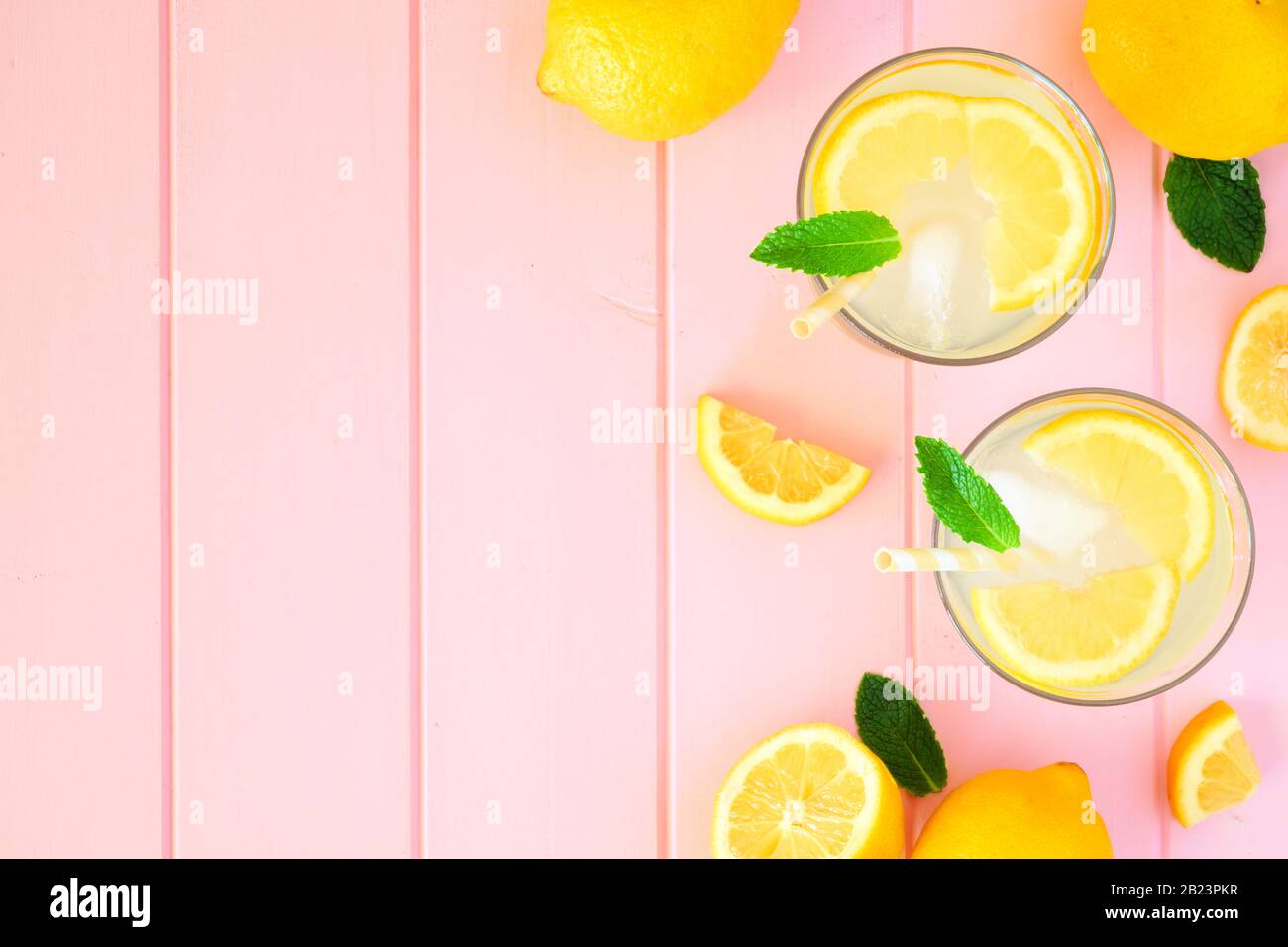 Sweet summer lemonade. Top view side border with copy space on a pastel ...