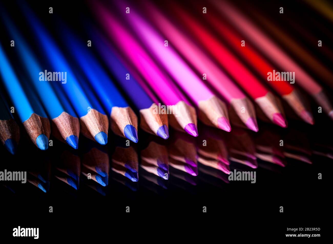 colored pencils on black background Stock Photo - Alamy
