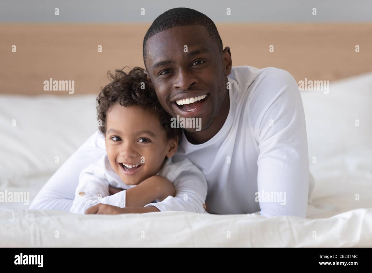 Head shot portrait smiling African American father and son Stock Photo ...