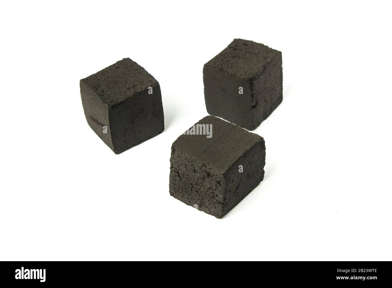 Cubes of coal for hookah isolated on white Stock Photo - Alamy