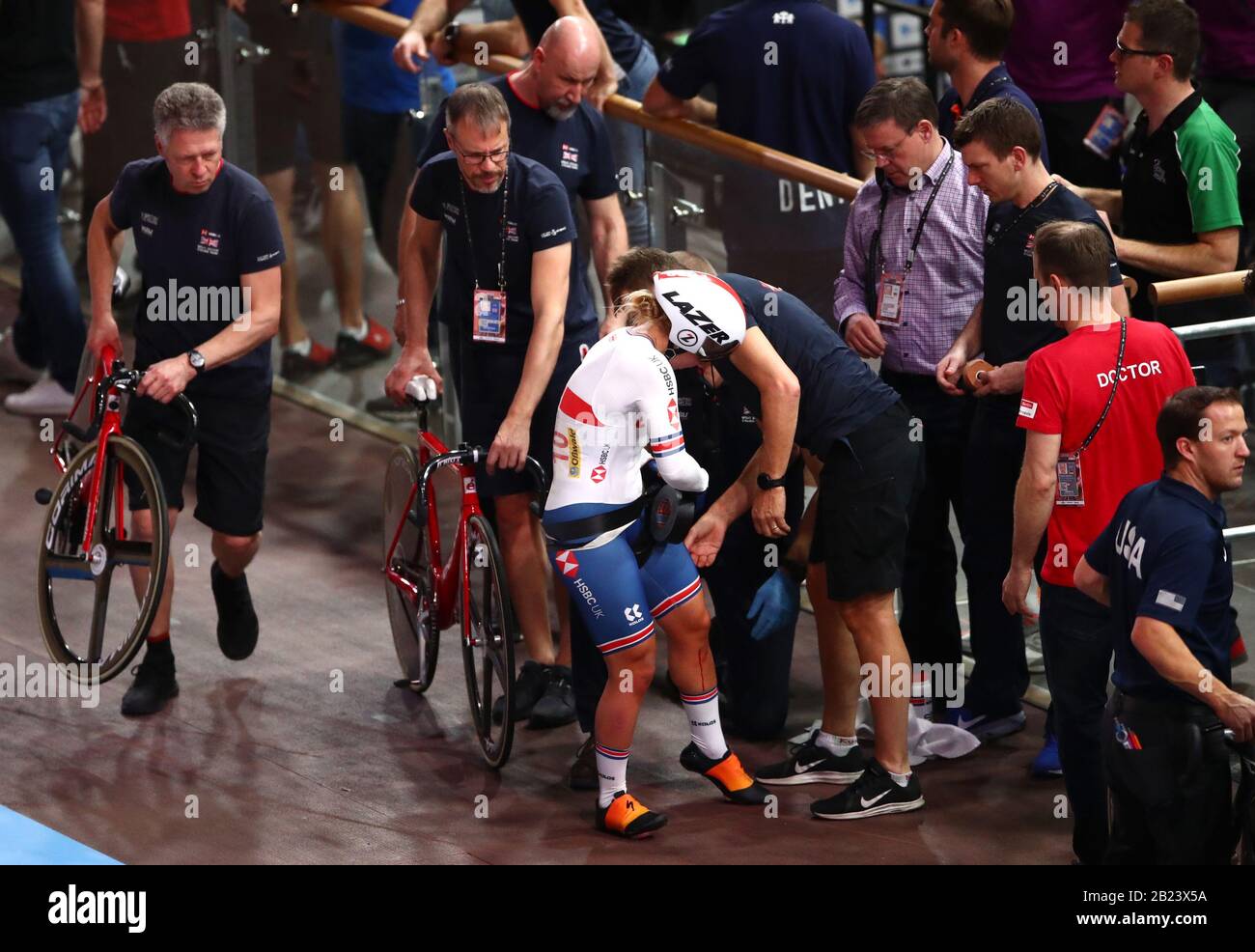 Great Britain's Neah Evans is patched up with gaffer tape by her team ...