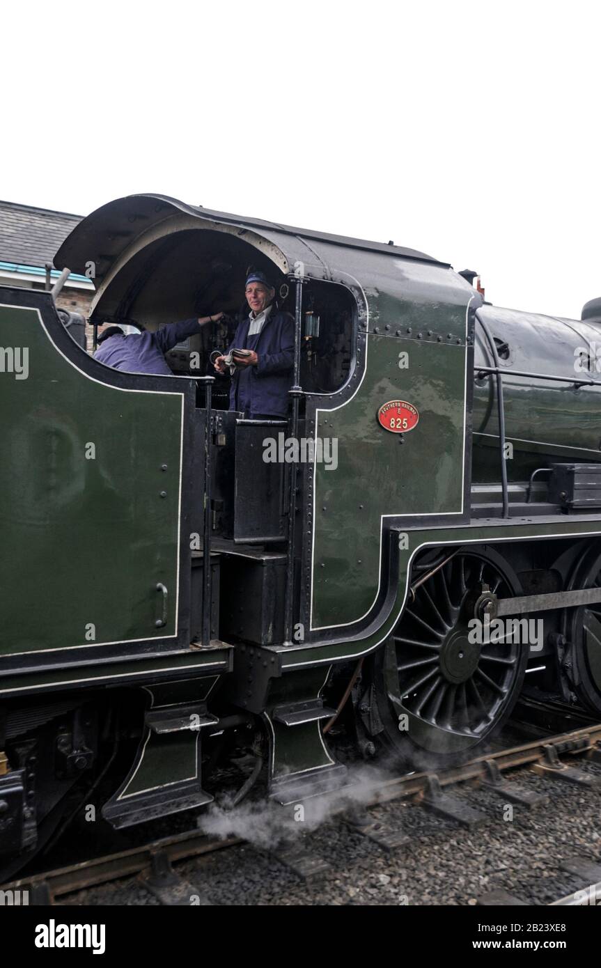 A steam engine driver on the footplate of the steam locomotive, No ...