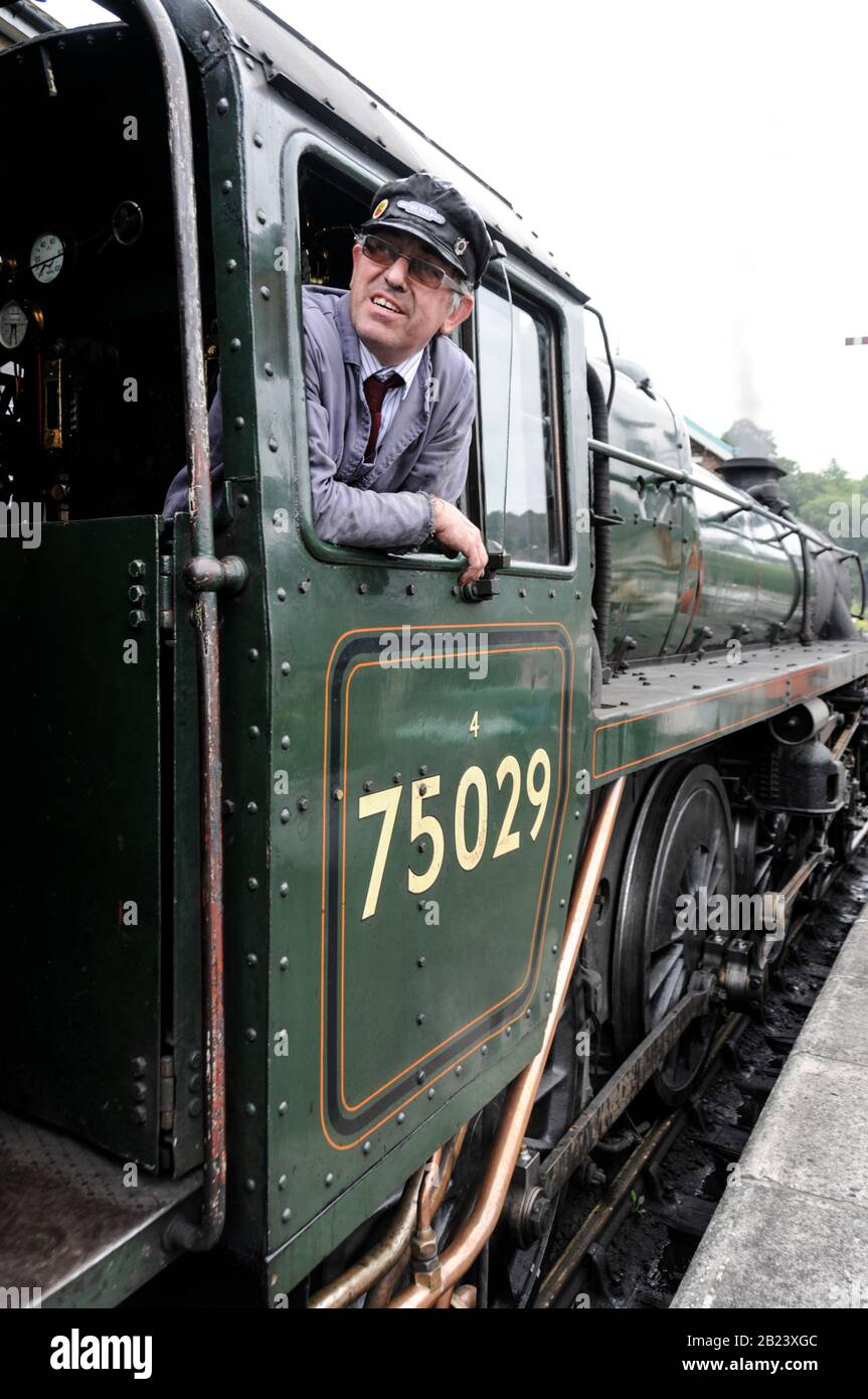A steam engine driver on the footplate of the steam locomotive, No ...