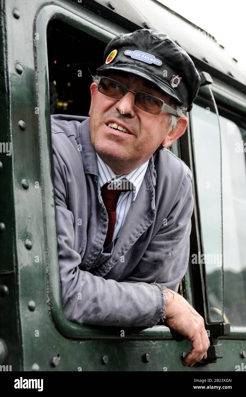 A steam engine driver on the footplate of the steam locomotive, No ...