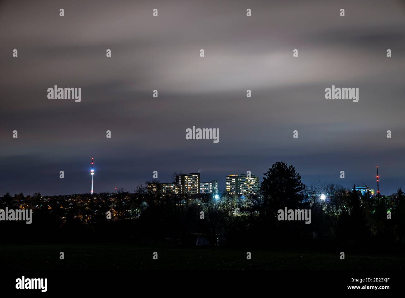 Germany, Magical night sky over skyline of city stuttgart illuminated ...