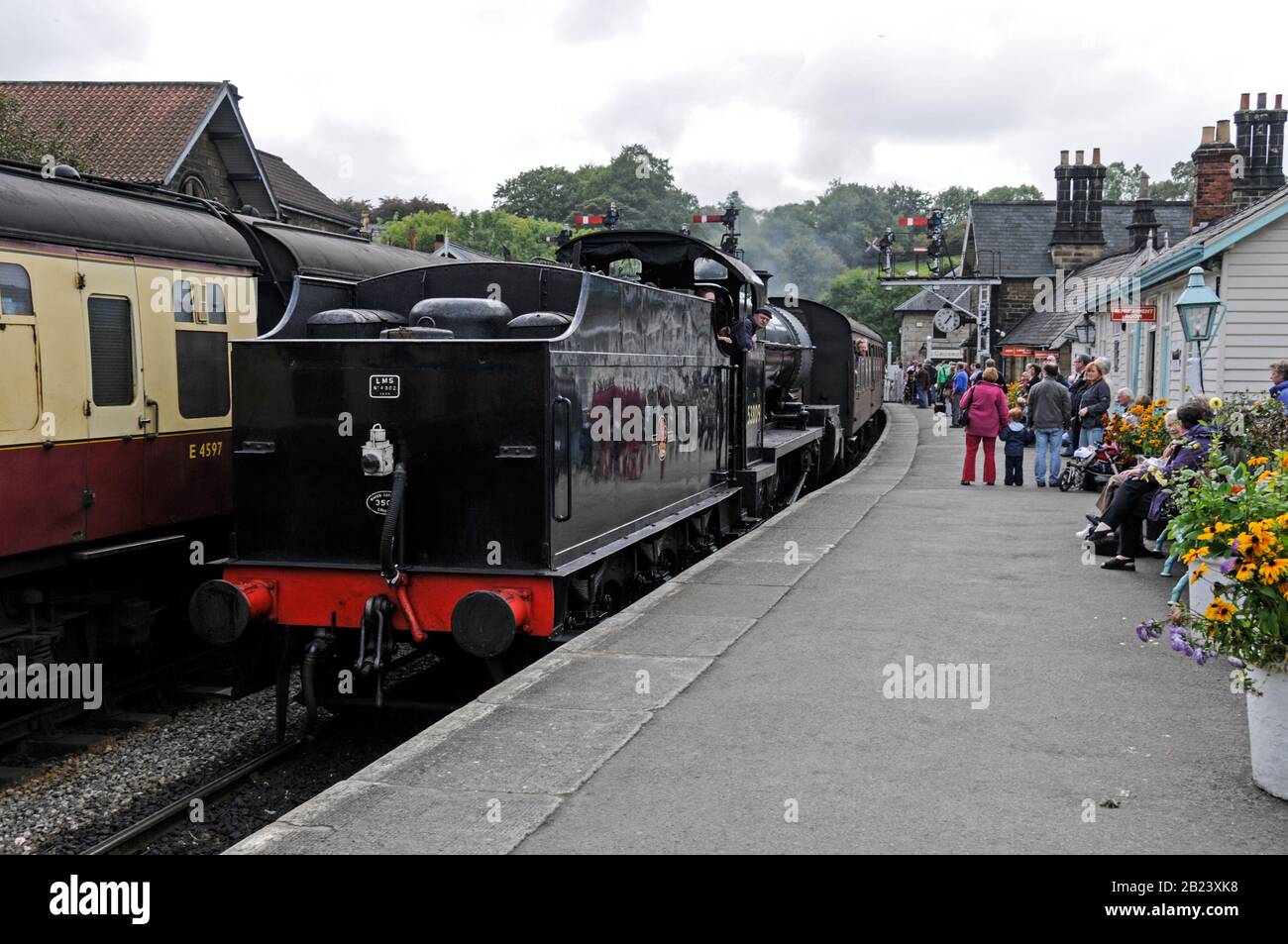 The black steam locomotive No:53809 pulling a fleet of passenger ...