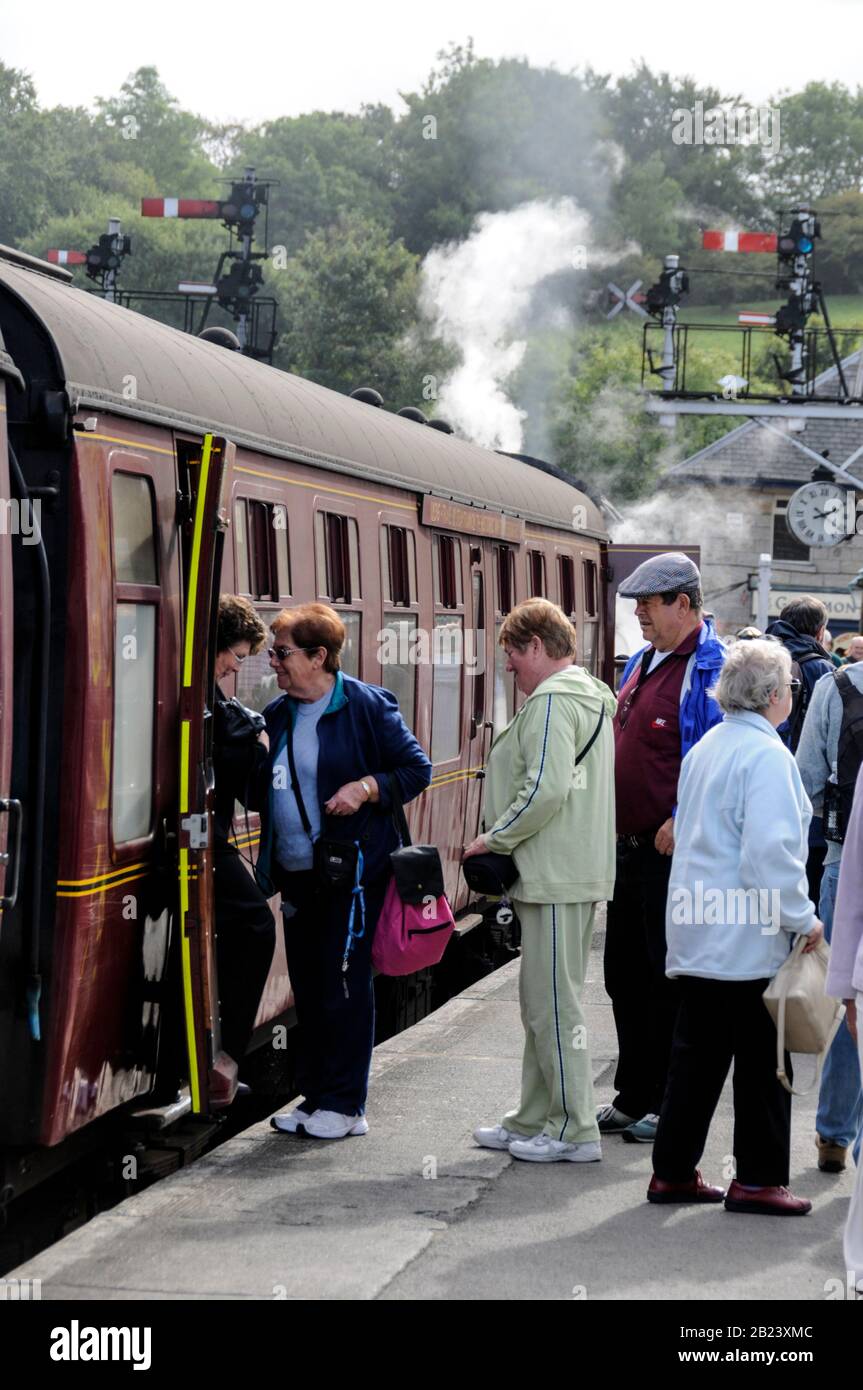 Passengers boarding the steam train at Grosmont rail station part of ...