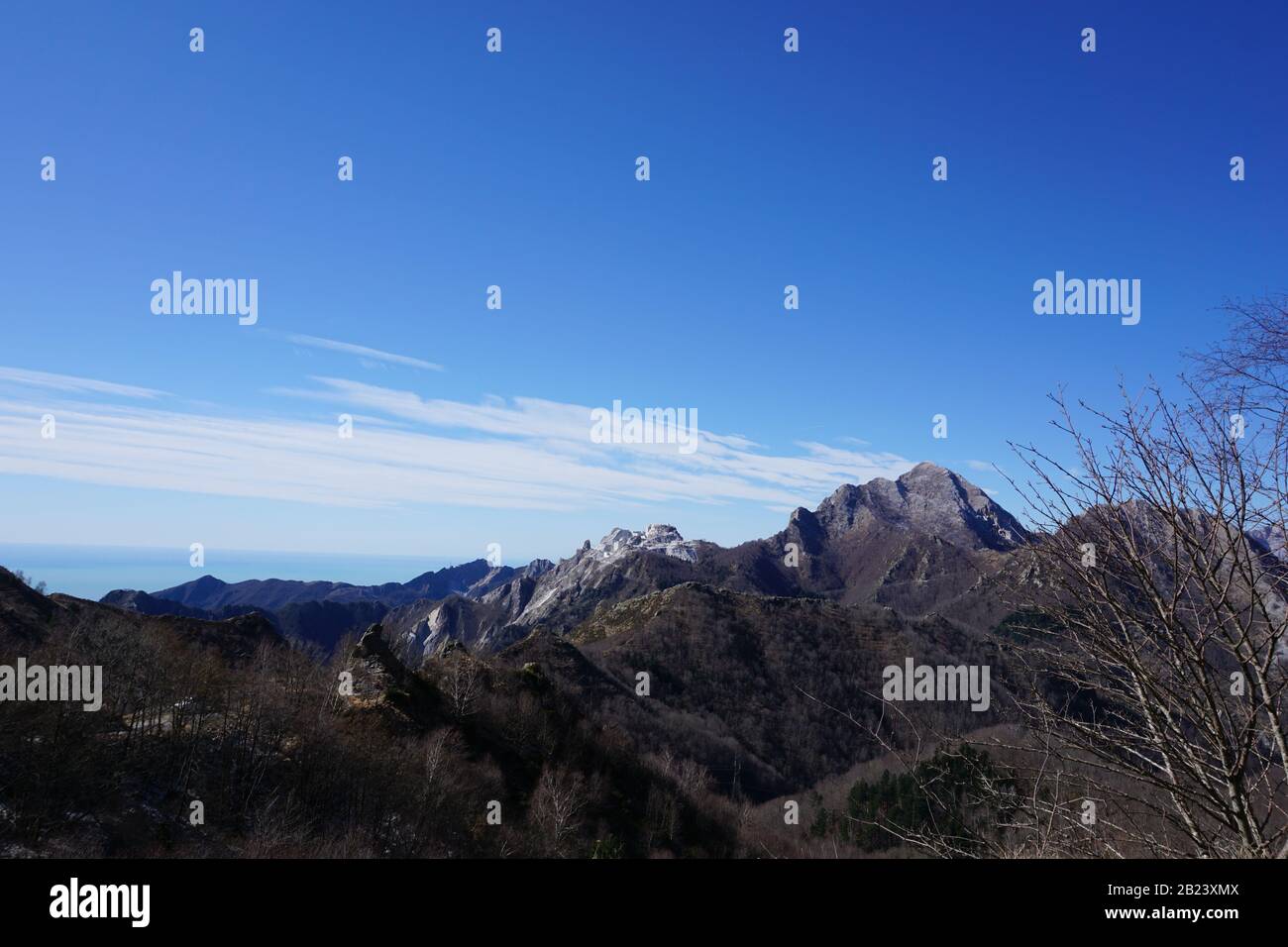 View of the Apuan Alps with a peak cut due to the extraction of white ...
