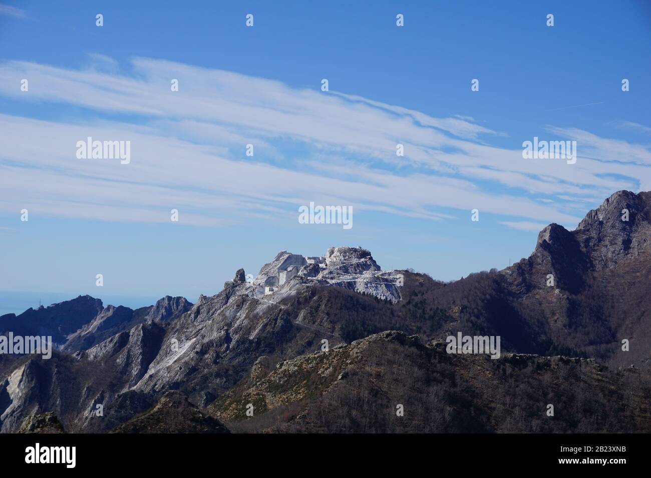 View of the Apuan Alps with a peak cut due to the extraction of white ...