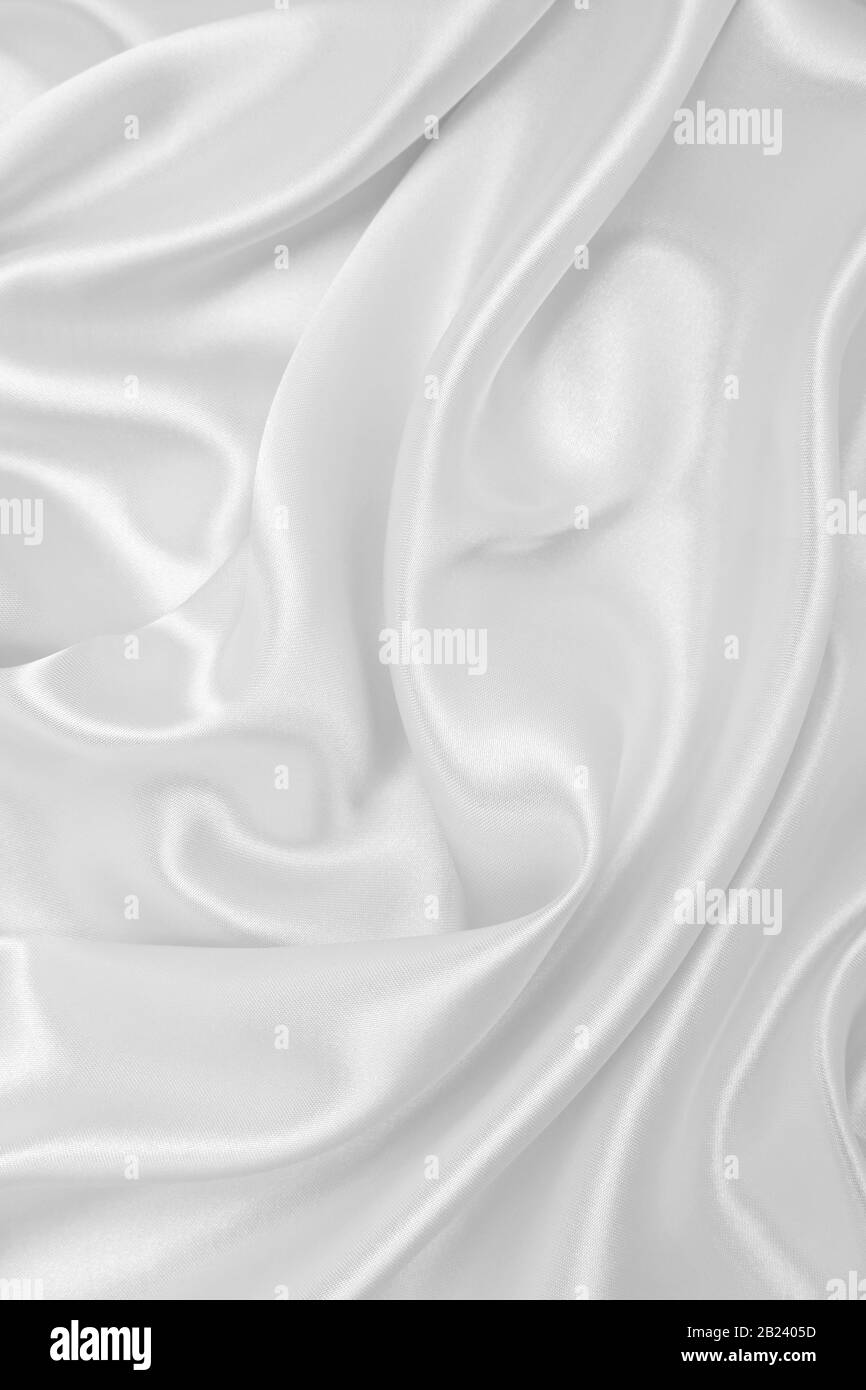 Smooth elegant white silk or satin luxury cloth texture can use as ...