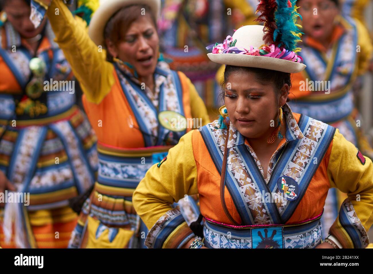 Traditional folk dancers performing as they parade through the mining ...