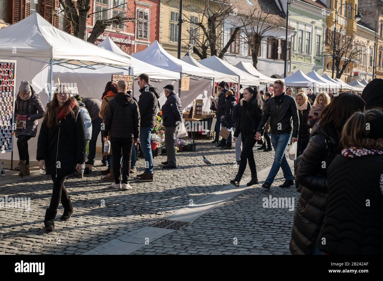 Sibiu city, Romania - February 29, 2020. People look at martisor at big ...