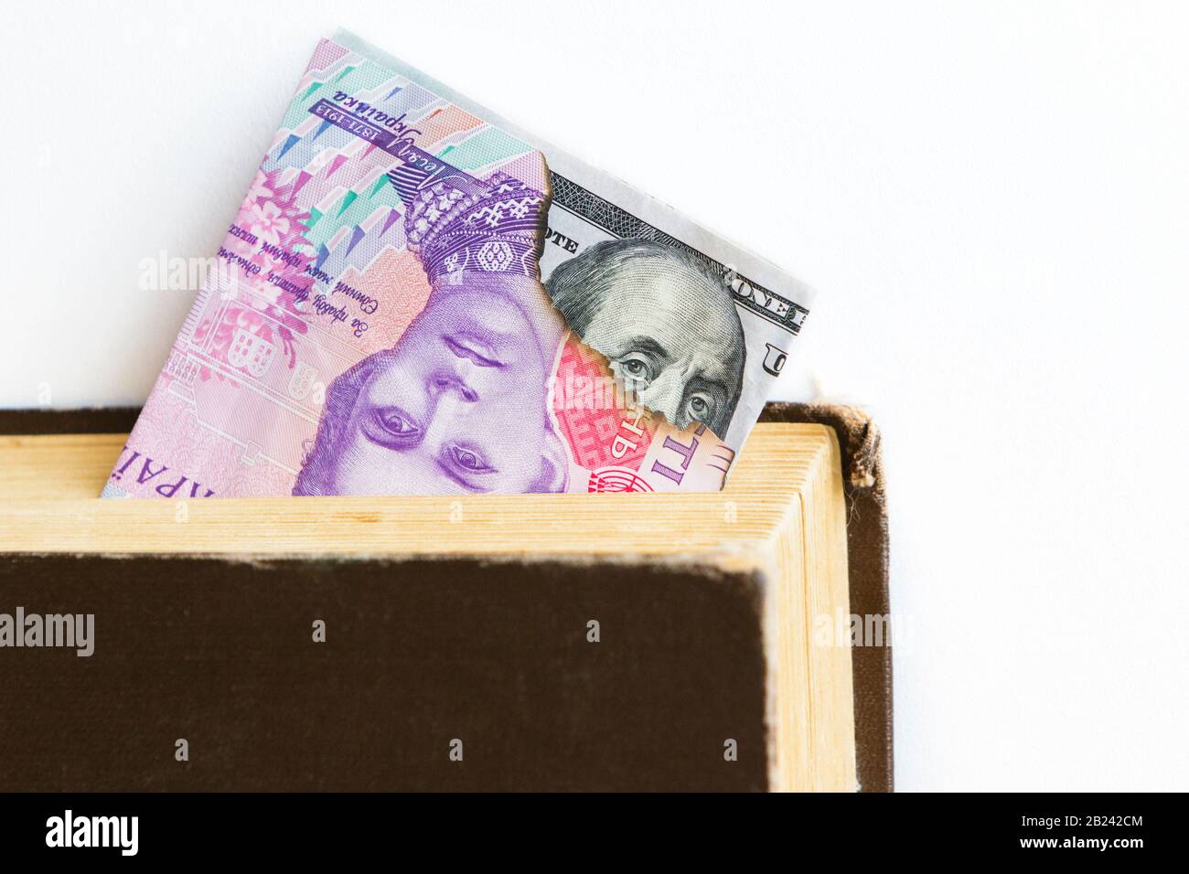 Book dollar hi-res stock photography and images - Alamy