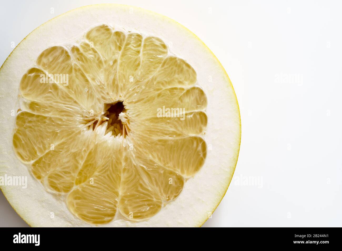 Macro shot of yellow pomelo slice. White background, high resolution ...