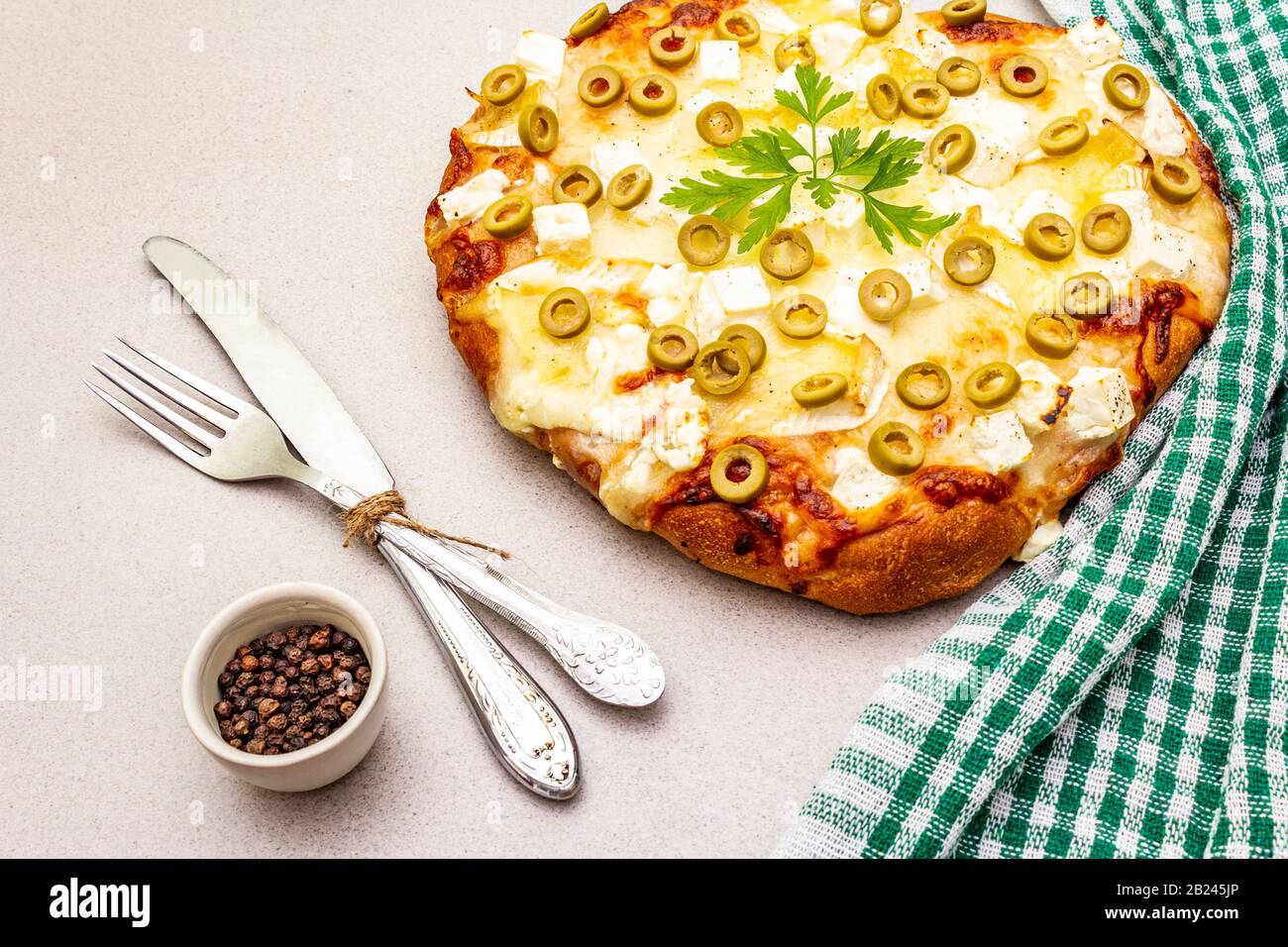 Italian focaccia with three types of cheese, green olives, black pepper ...