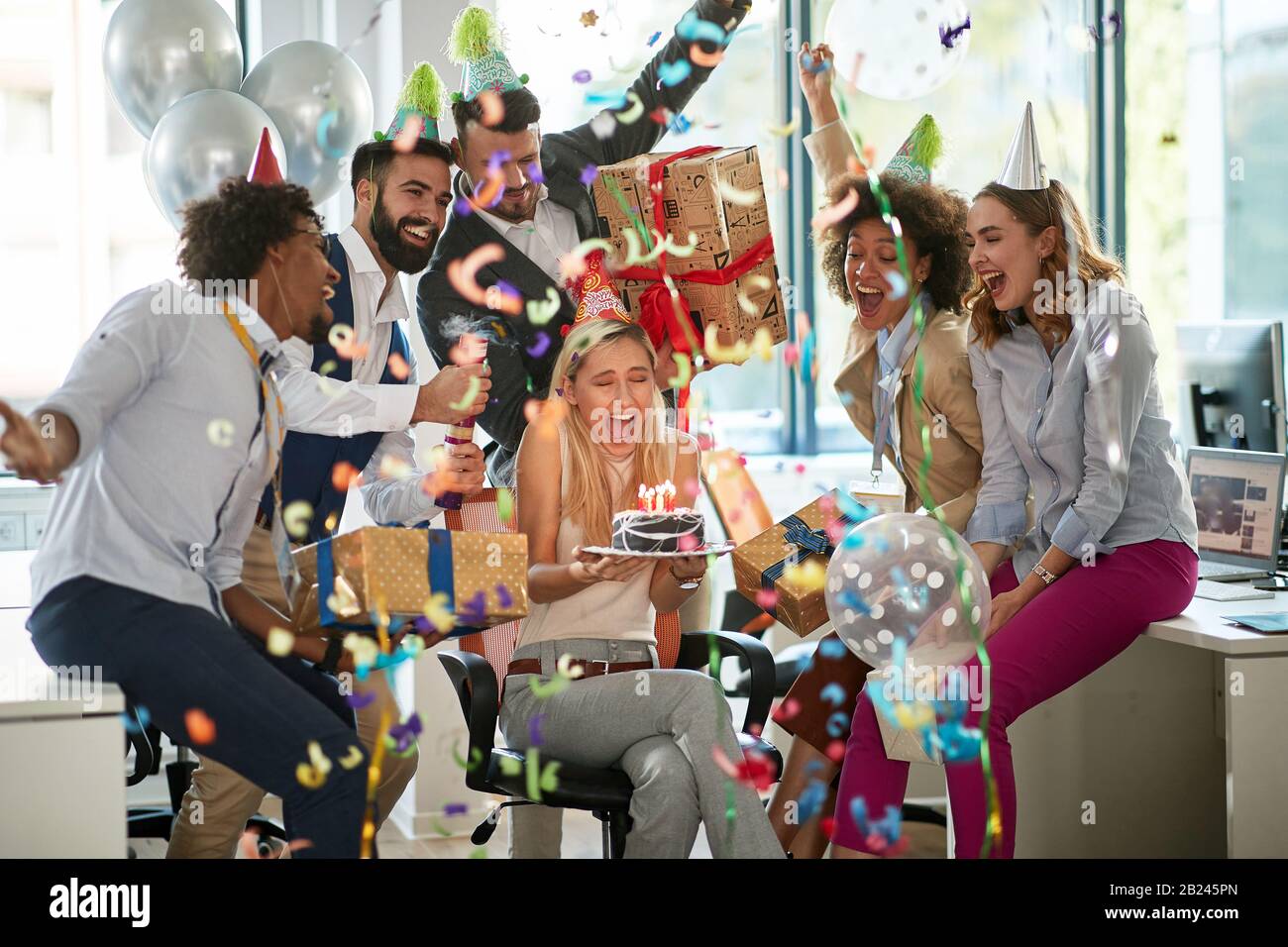 Celebrating a colleague's birthday in the office at work.Happy birthday ...