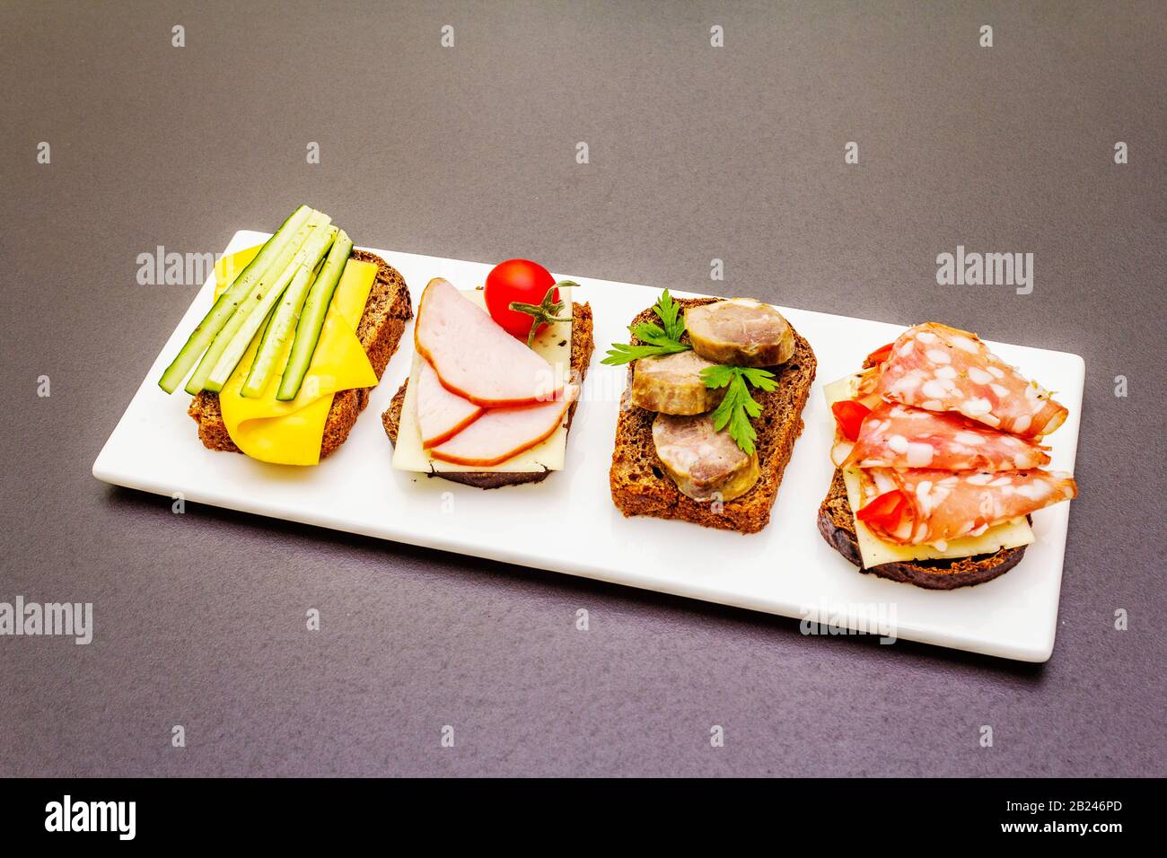 Assorted sandwiches with different fillings, meats, cheese and ...