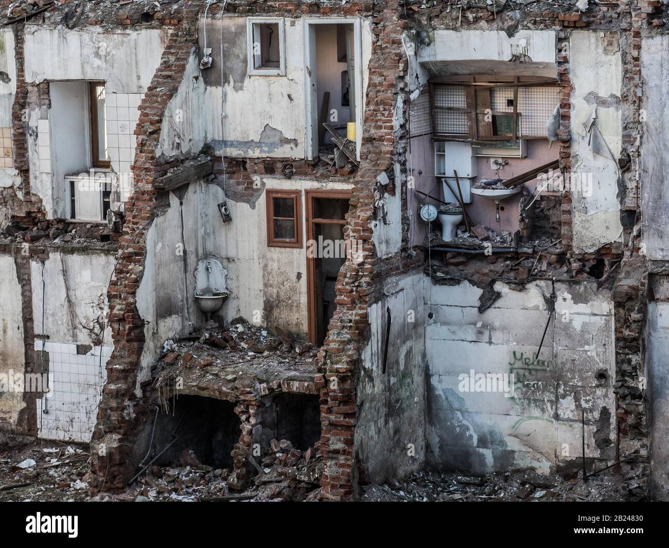 Facade of a ruined building, partly demolished residential building ...