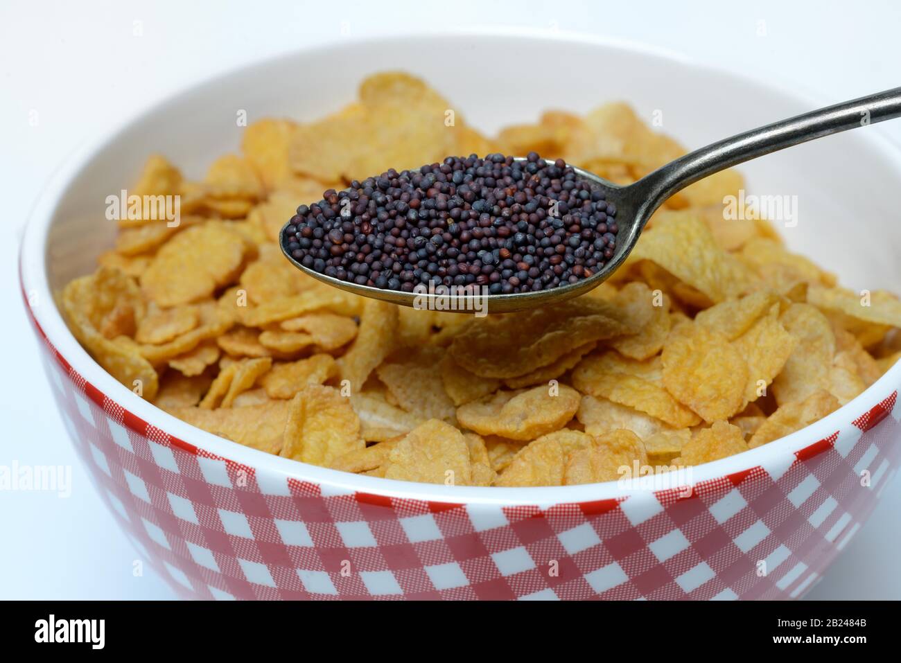 Broccoli seeds in spoon and bowl with cornflakes, Germany Stock Photo ...
