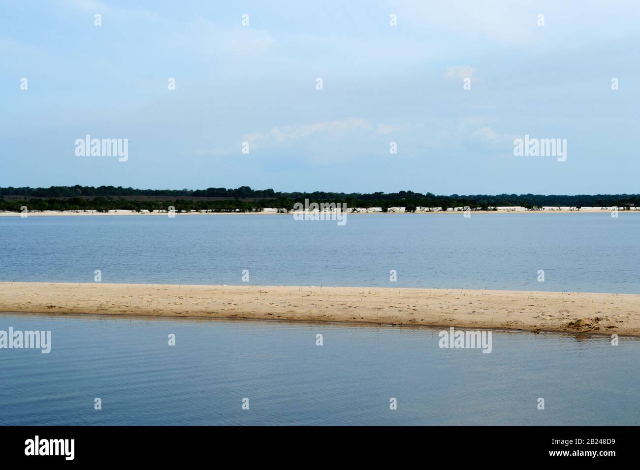 A narrow strip of land on the Amazon River in the north of Brazil in ...