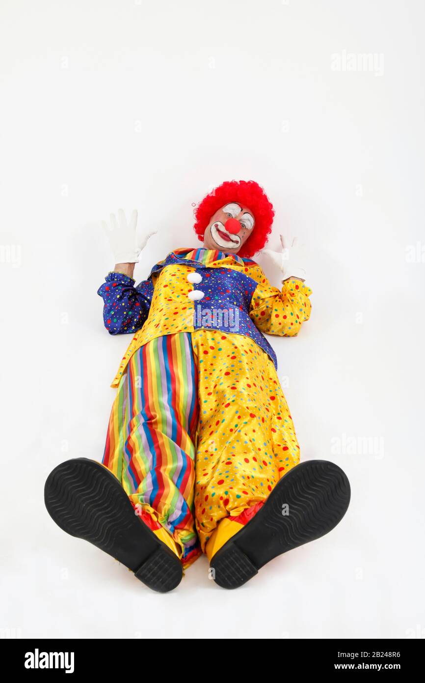 Clown lying, Germany Stock Photo - Alamy