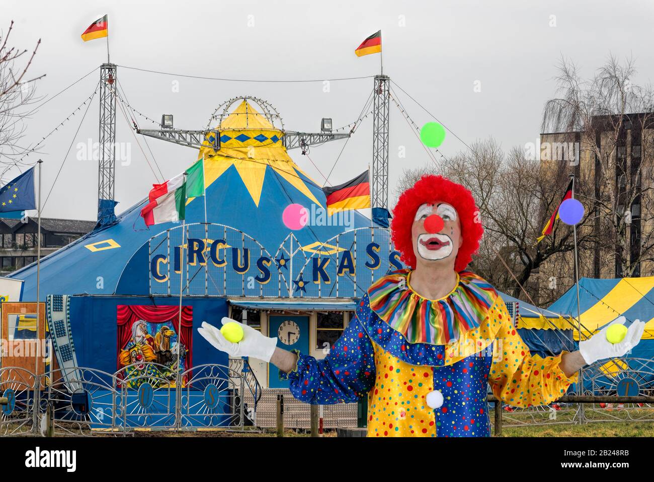 PHOTOMONTAGE, circus tent with clown juggling, Germany Stock Photo - Alamy