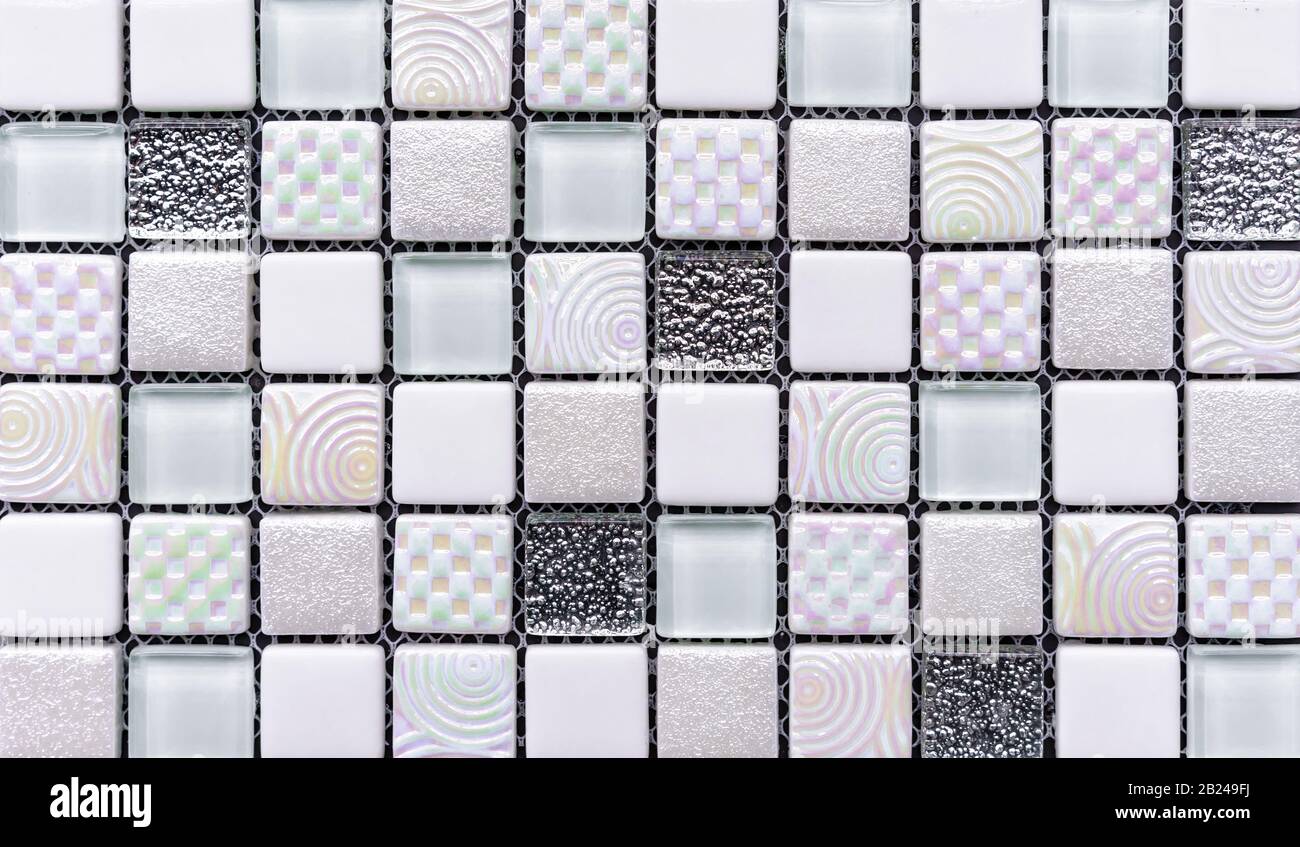 Ceramic mosaic tiles with gray and white embossed squares to decorate ...