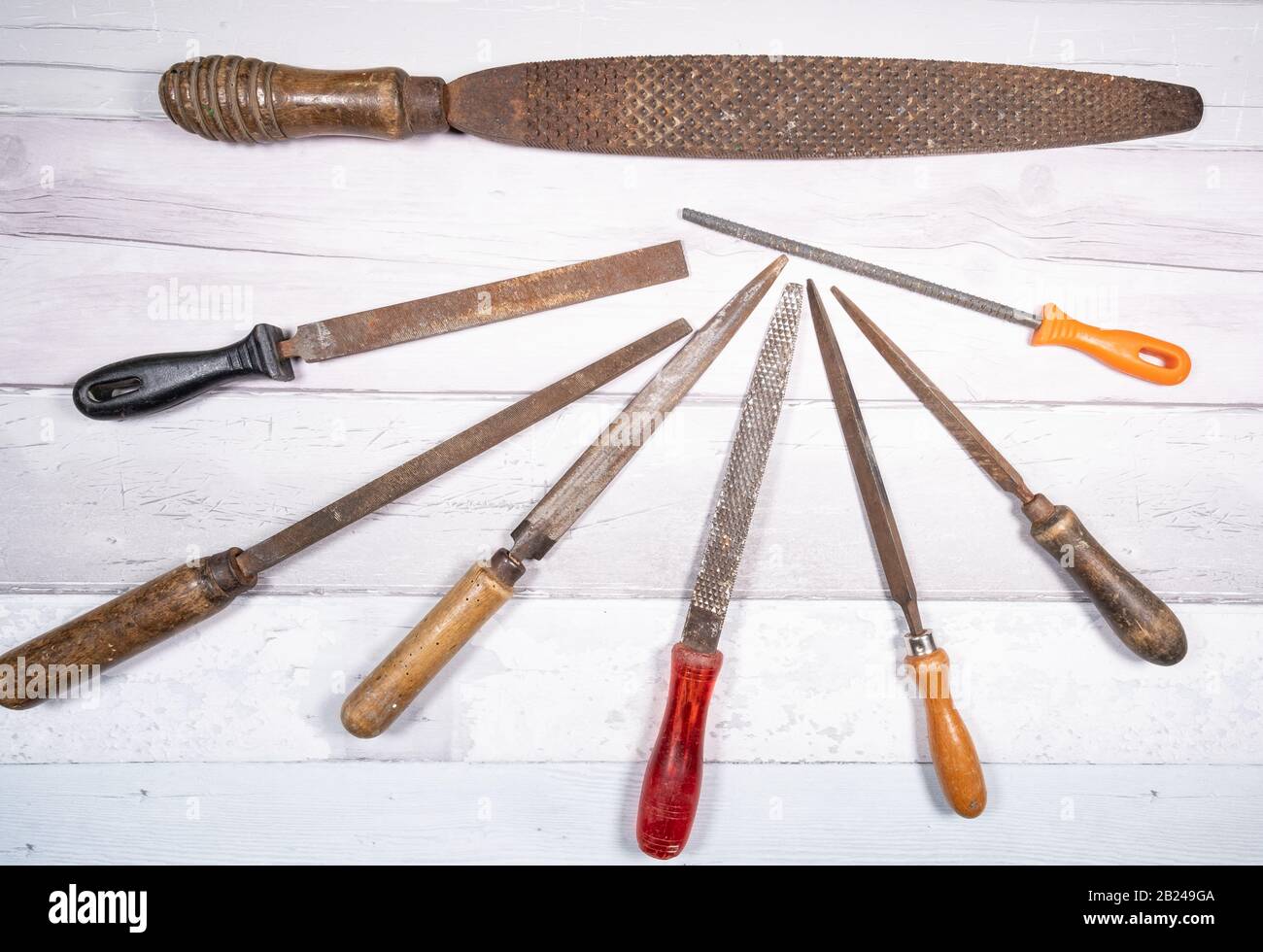 Sets of different wood rasps of different sizes in the middle of an old ...