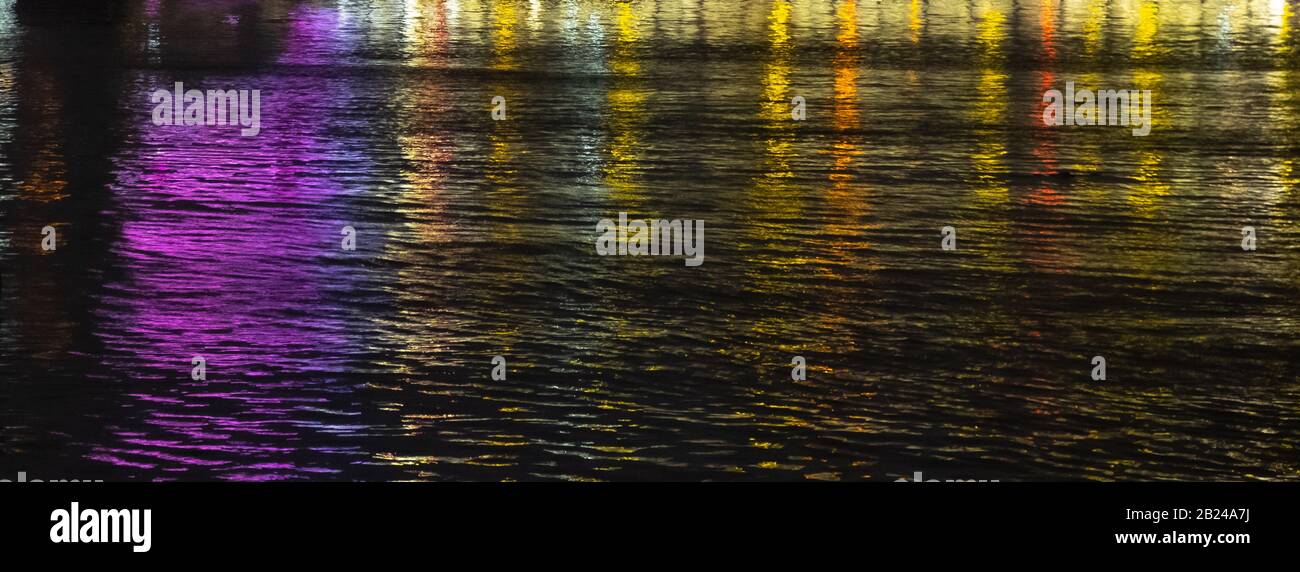 Shimmering water with multiple colors Stock Photo - Alamy