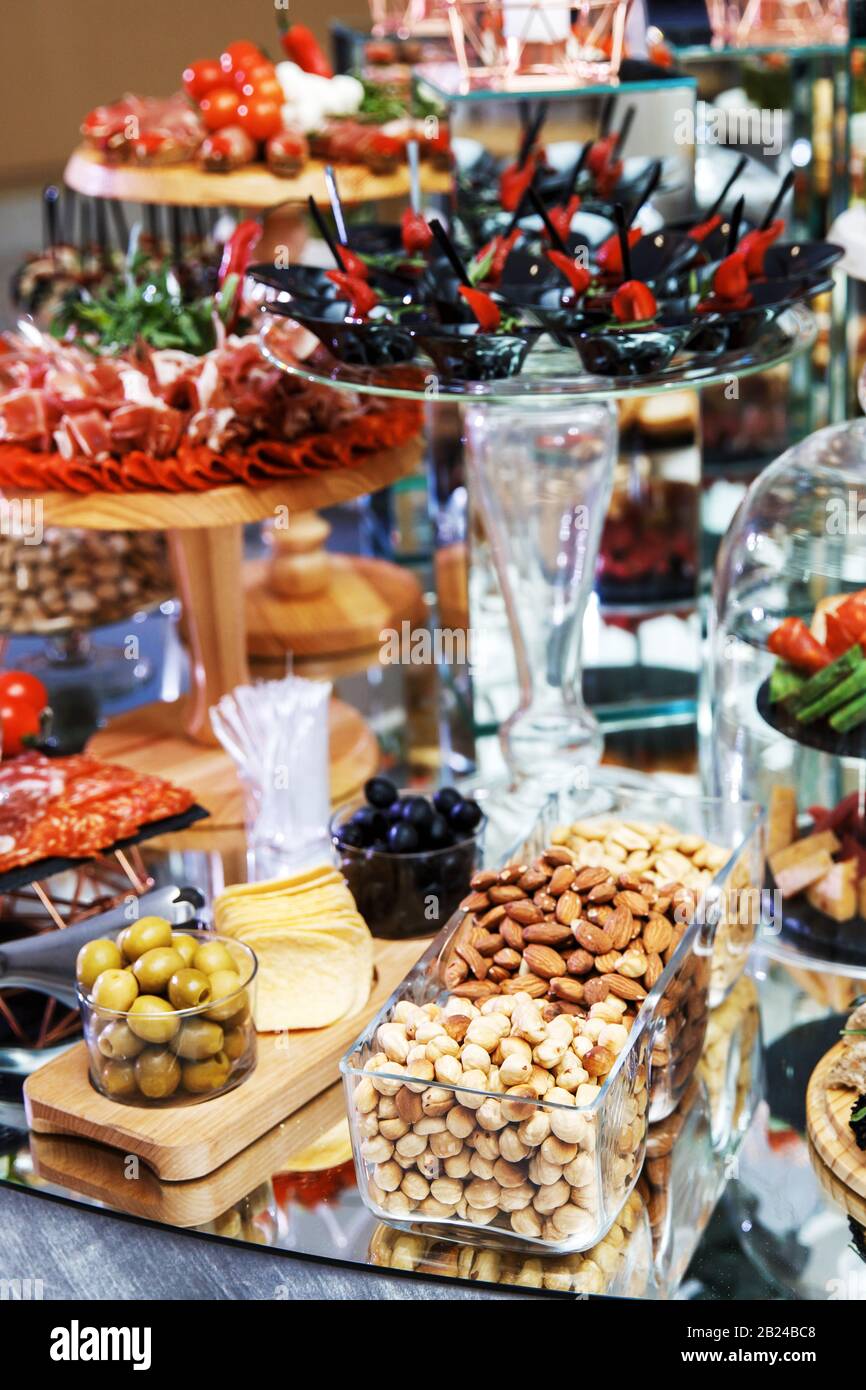 Snack for alcoholic beverages on the buffet table Stock Photo - Alamy