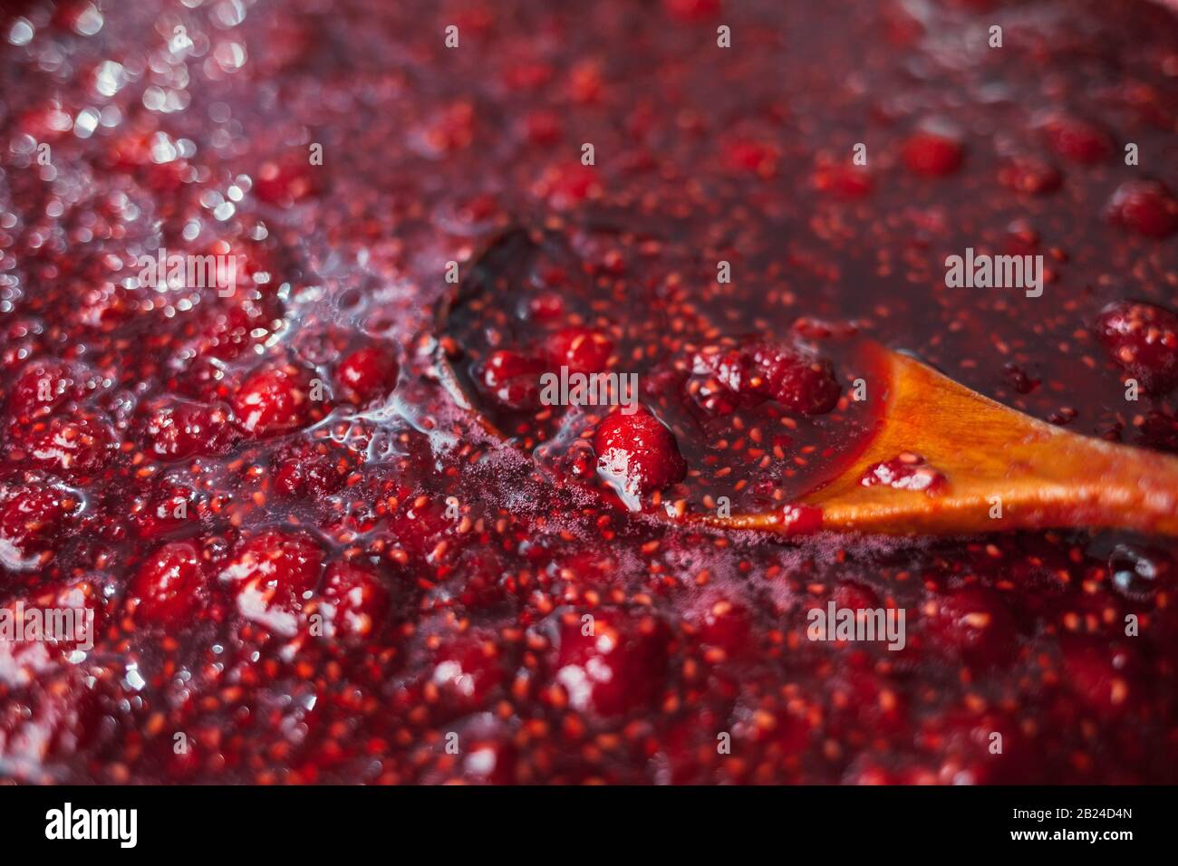 beautiful glare texture of raspberry jam closeup, food background Stock ...