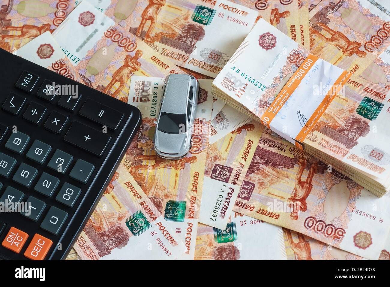 The concept of buying a personal car: model cars, a calculator and a ...