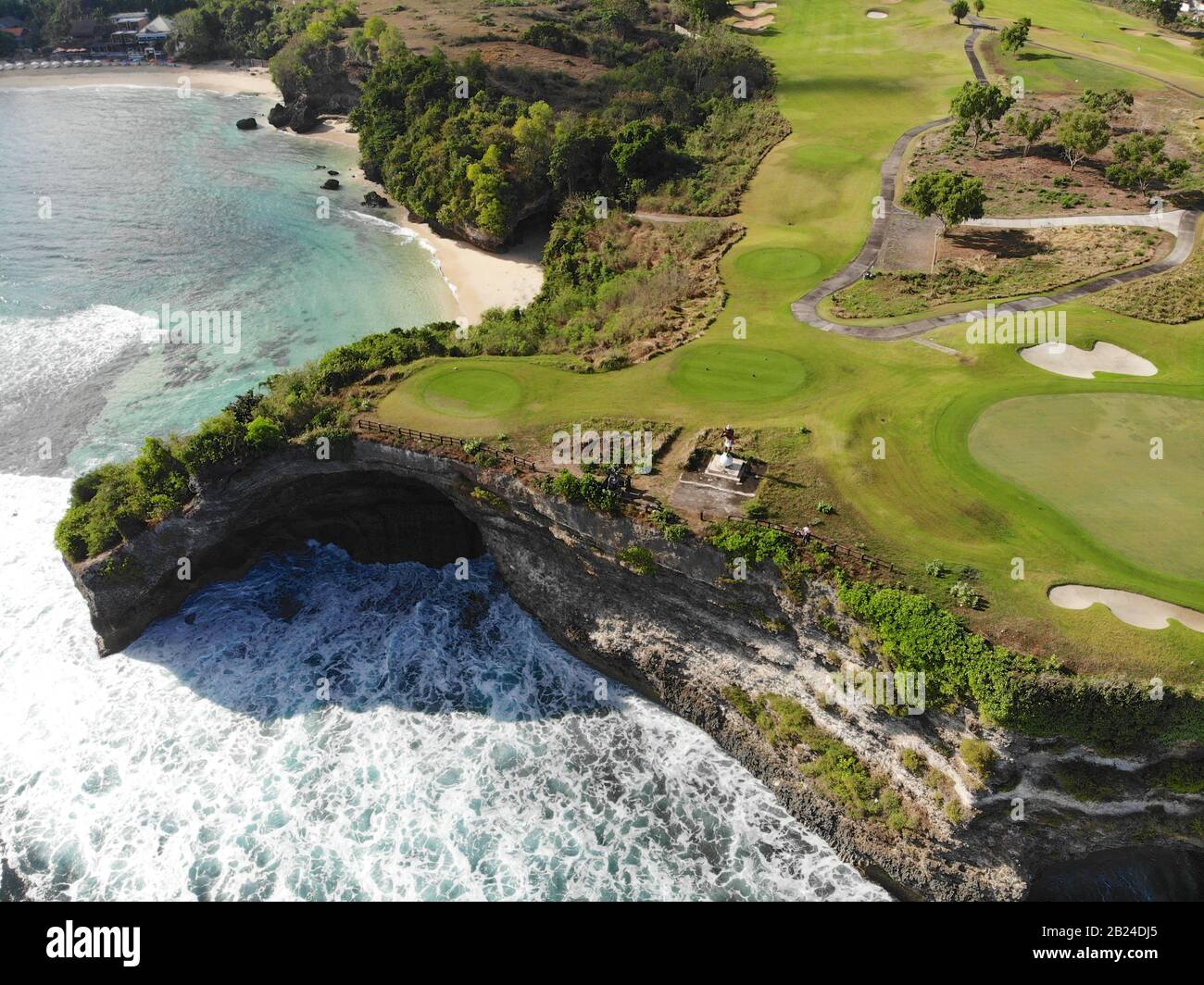 Aerial view of luxury golf field next the cliff, ocean and beach in ...