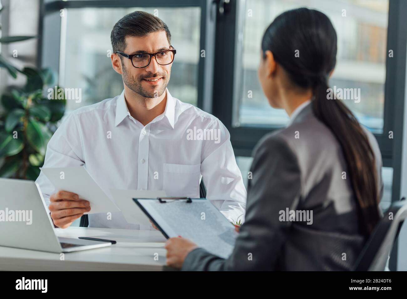 Handsome male translator holding hi-res stock photography and images ...