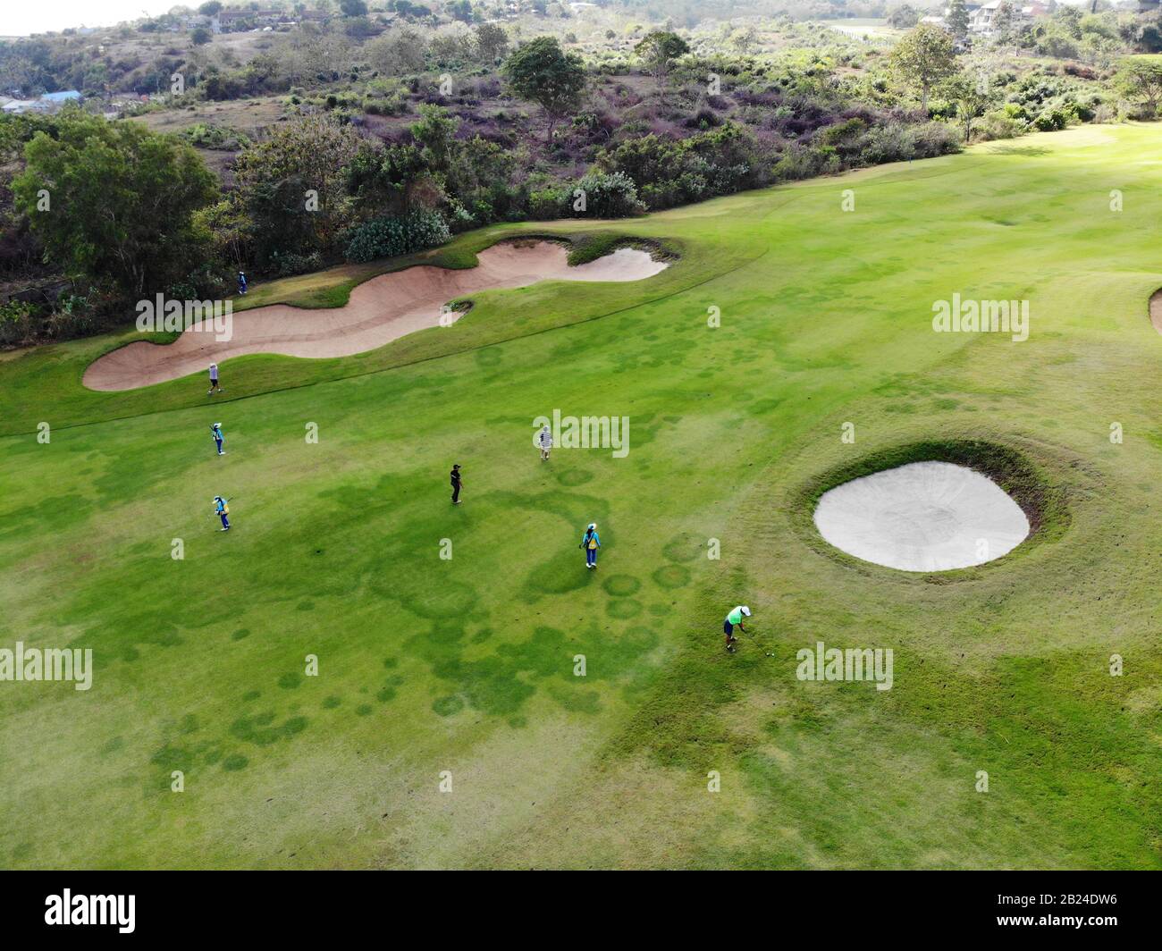 Aerial view of golf course with player, footpath on golf course, playr ...