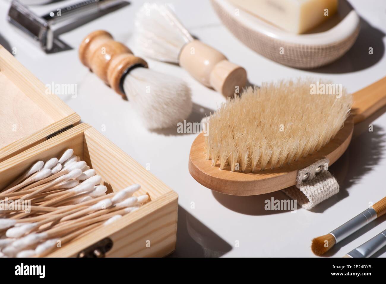 Selective focus of shaving brushes, box of ear sticks, Hair brush on ...
