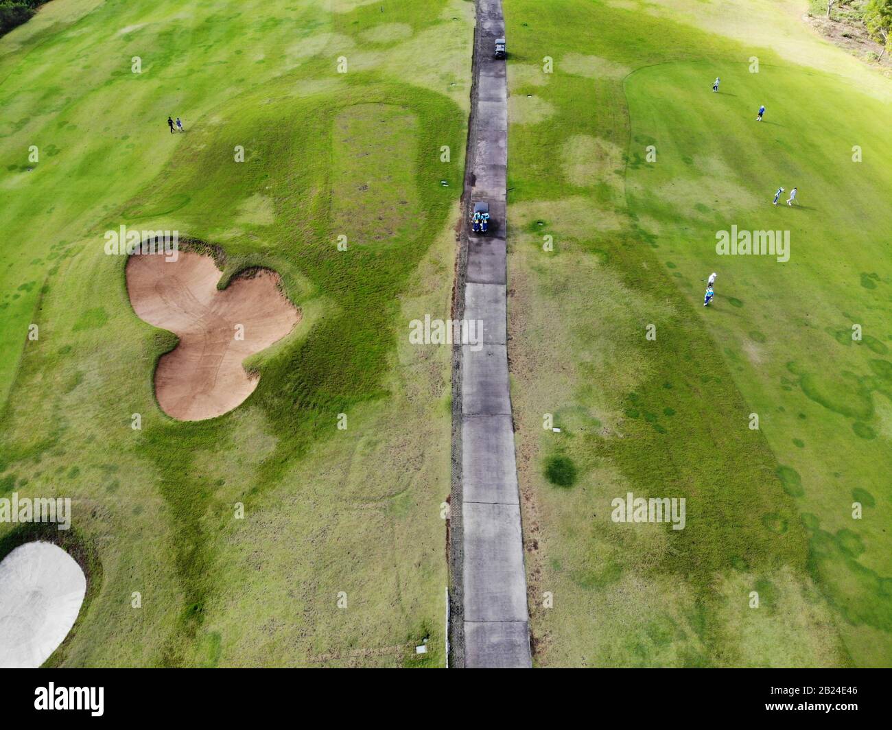 Aerial view of golf course with player, footpath on golf course, playr ...