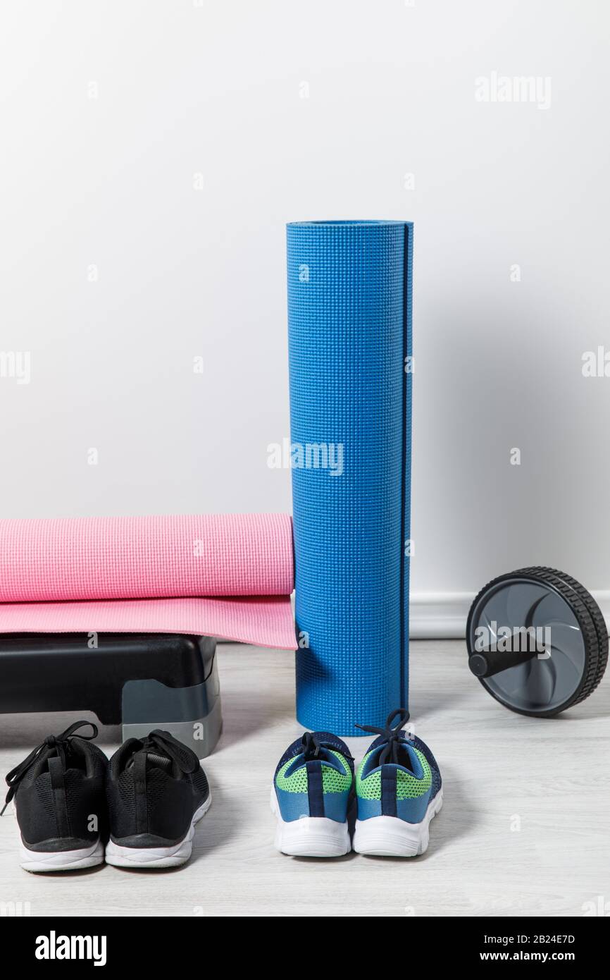 step platform, fitness mats and sport equipment on floor at home Stock ...