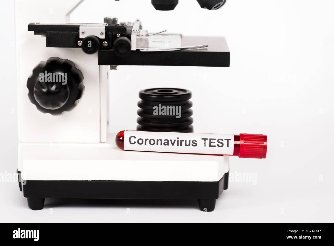 microscope and sample with coronavirus test lettering on white Stock ...