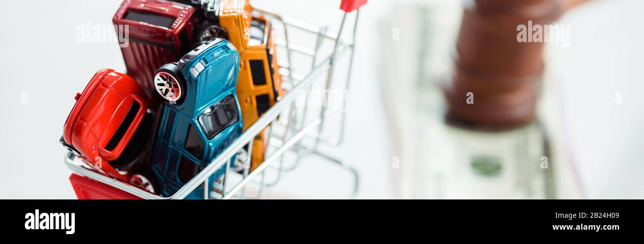 panoramic shot of shopping trolley with models of cars Stock Photo - Alamy
