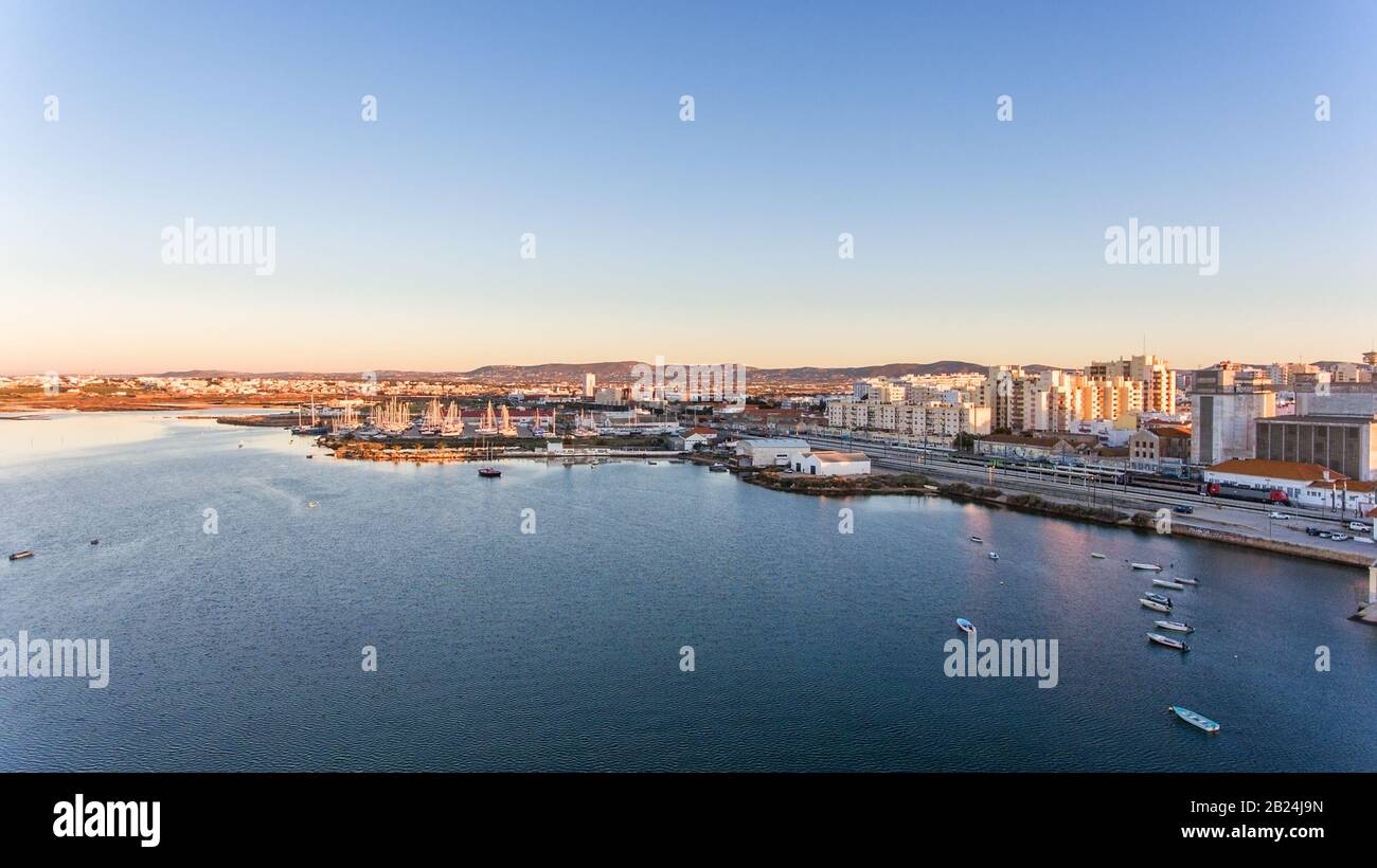 Morning sunrise over the tourist city of Faro, Portugal, Algarve Stock ...