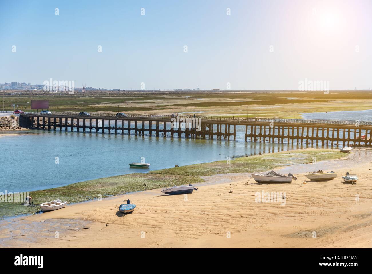 An old bridge on Faro Beach, across the Ria Formosa. Portugal Algarve ...