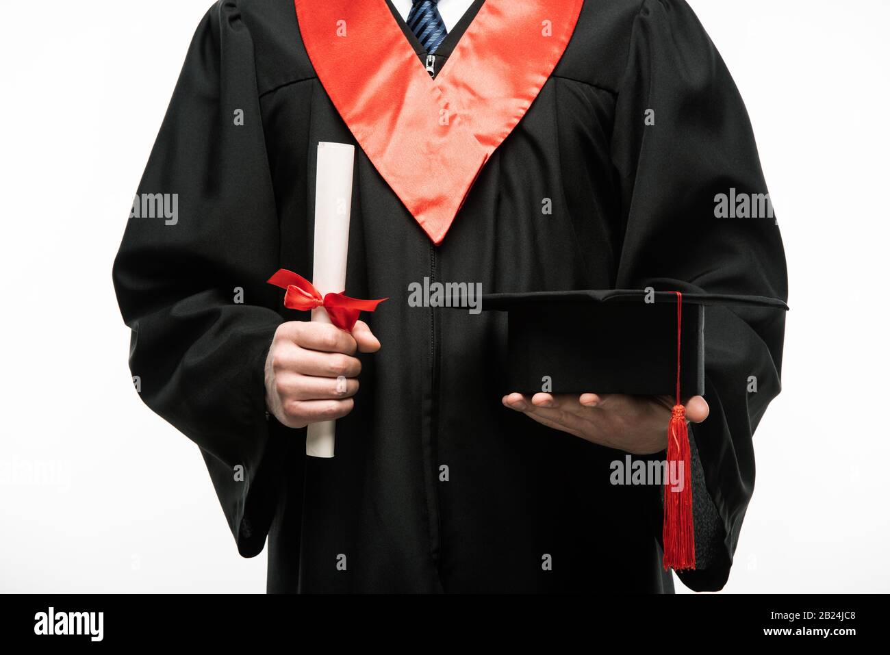 Front view of student holding graduation cap and diploma isolated on ...